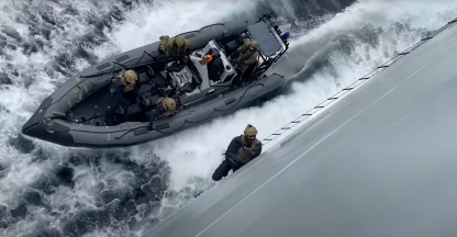 Watch a Royal Marine use a jet pack to fly over and board an enemy ship