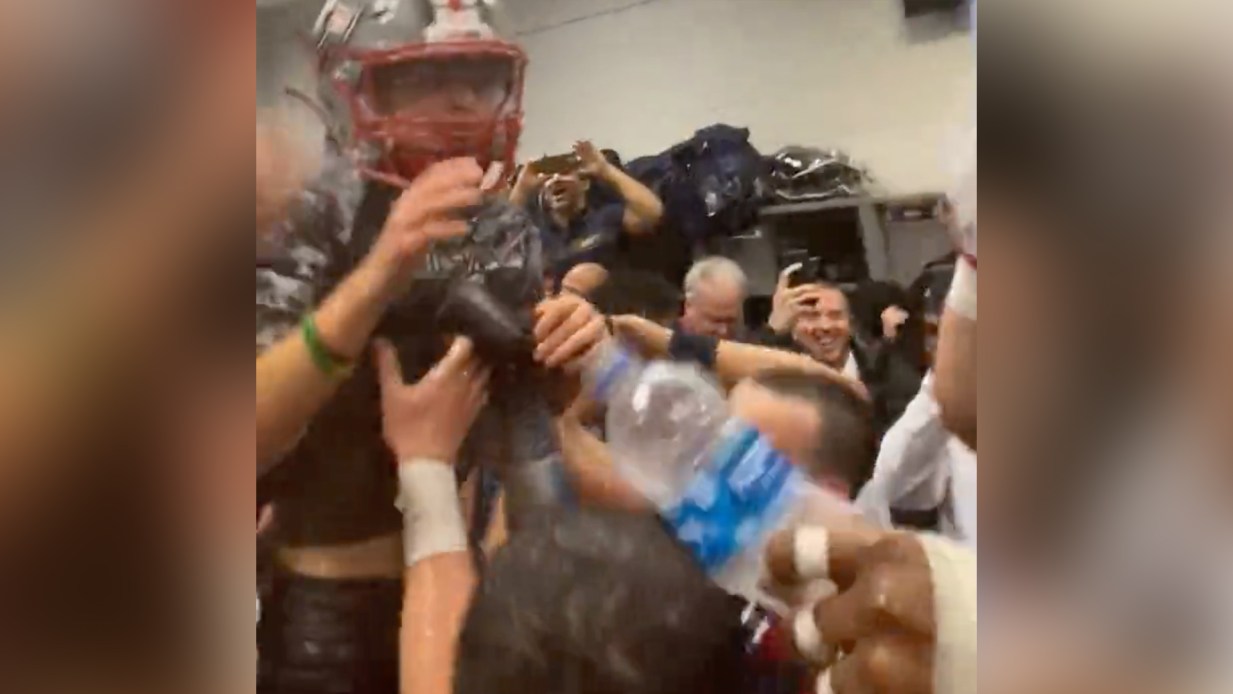 Navy Football team celebrates win against Army with son of fallen SEAL