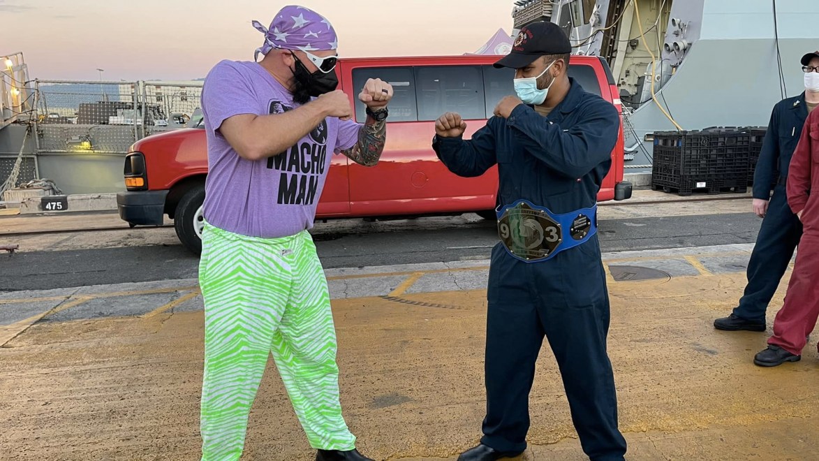 Navy commander dresses up like pro wrestlers to present awards to sailors