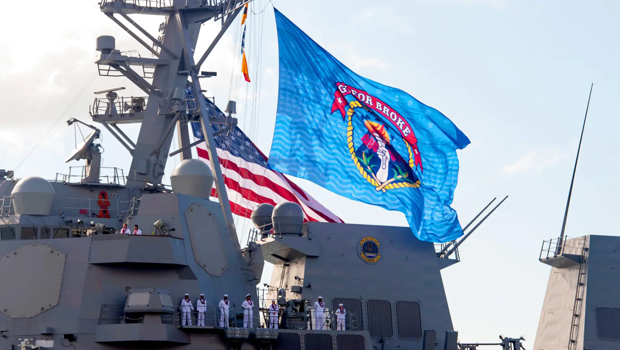 Navy destroyer USS Daniel Inouye flies 'Go For Broke' battle flag in port