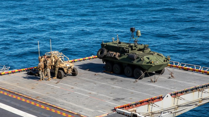 Marine Corps straps electronic warfare LAV to deck of Navy warship