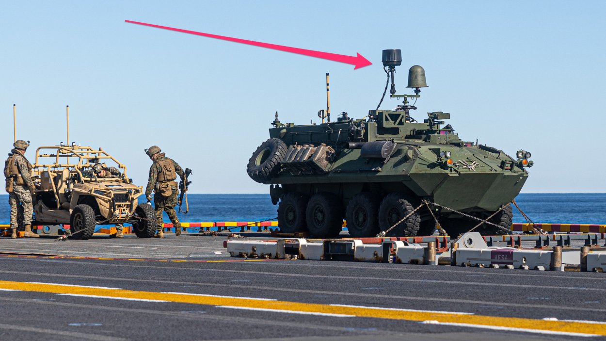 Marine Corps straps electronic warfare LAV to deck of Navy warship