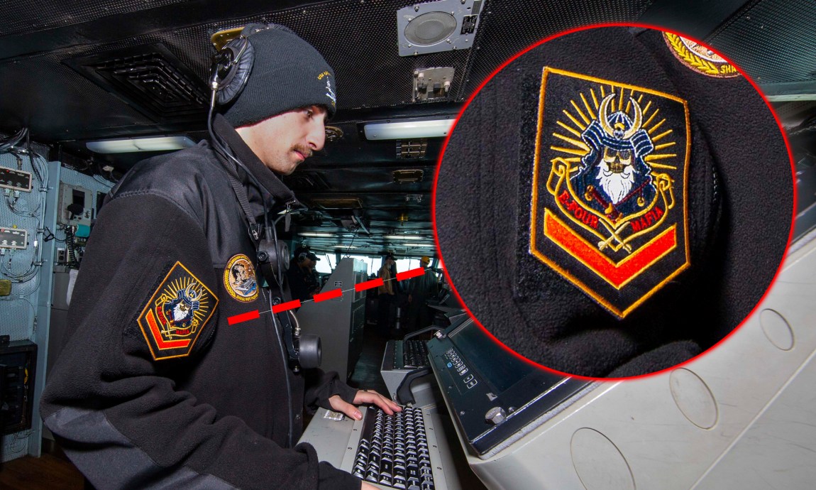 This USS Abraham Lincoln sailor proudly wears 'E-4 Mafia' patch