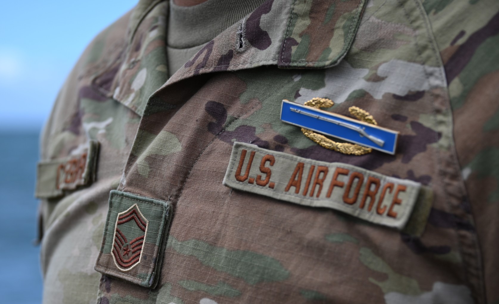 Air Force member pins on the Army's new Master Combat badge