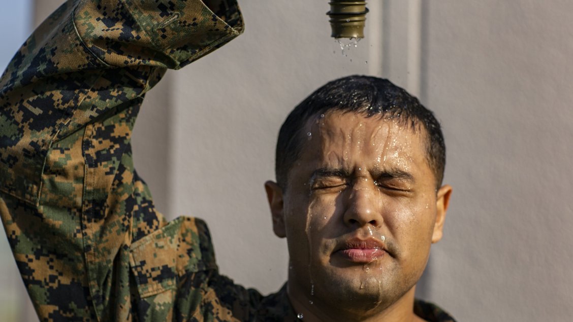 Marines issuing portable air conditioners for hot barracks